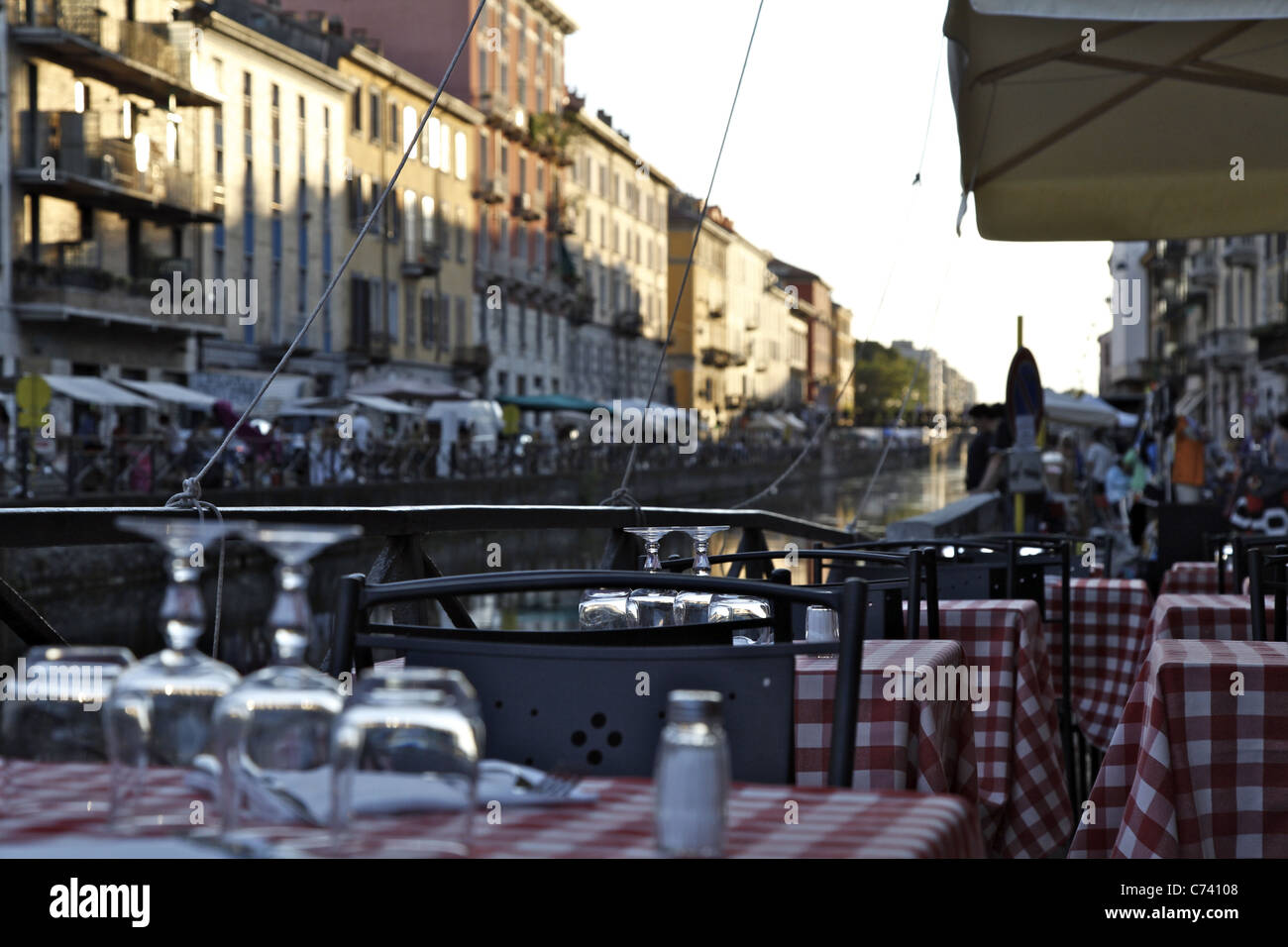 Dining tables in one of the restaurants on Naviglio Grande in Milan ...