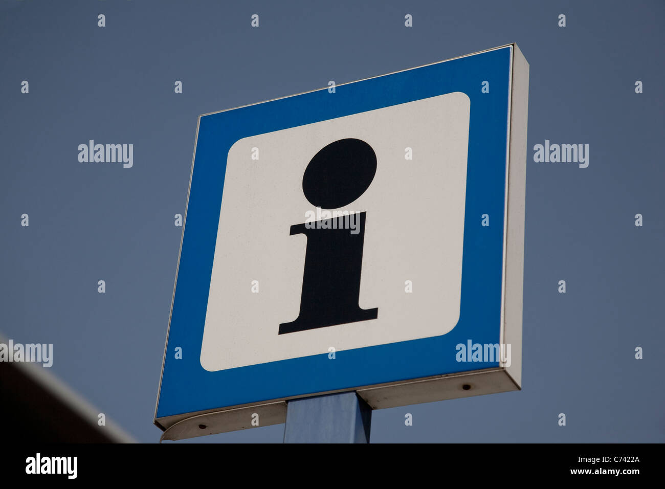 Information Sign against a Blue Sky Background Stock Photo - Alamy