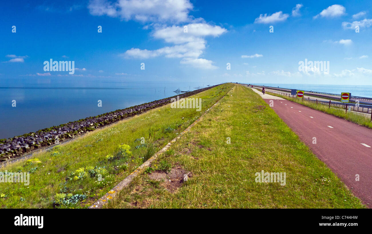 The road and bike cycle path on the Afsluitdjk, Netherlands Stock Photo ...