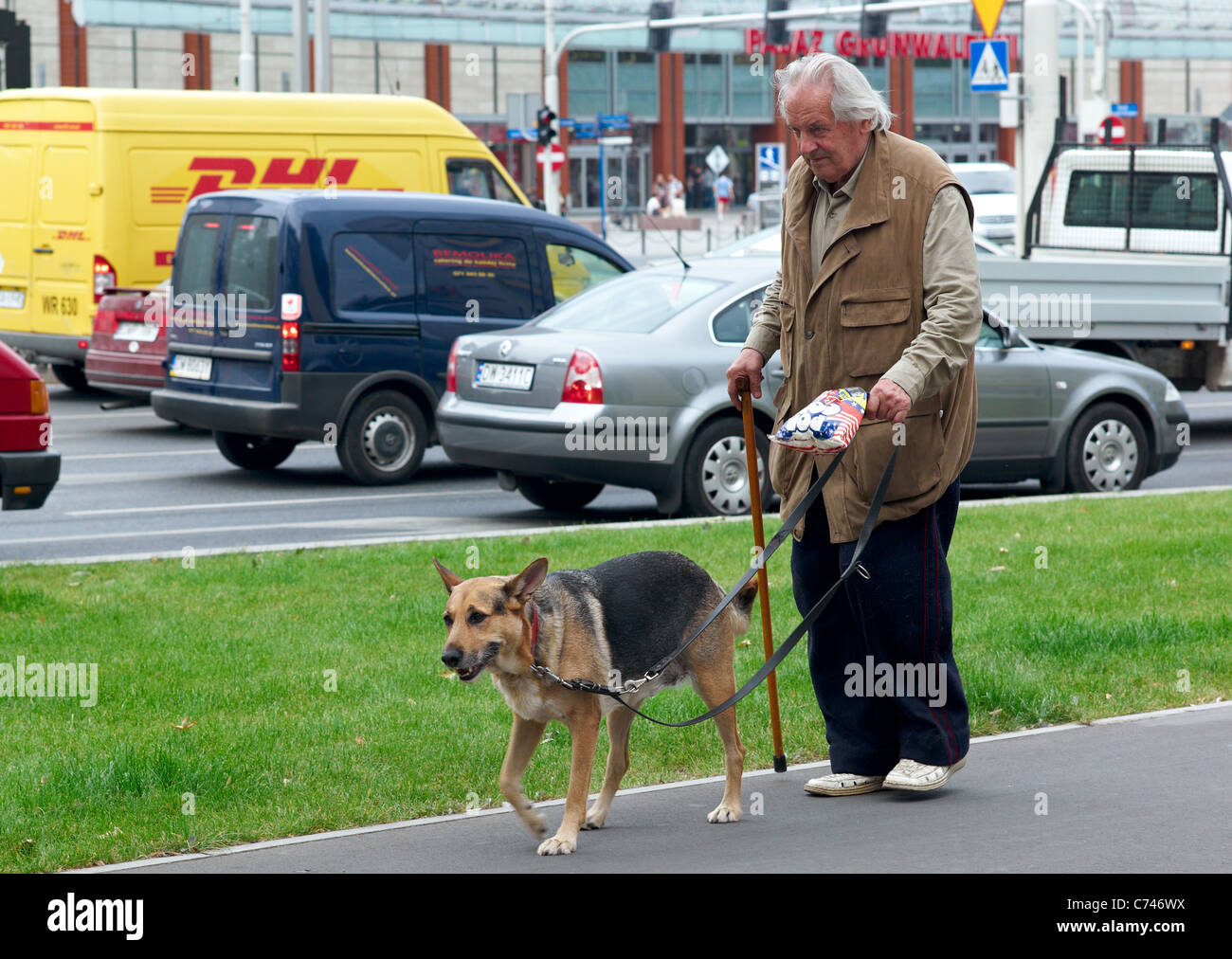 A man walking his German shepherd, Wroclaw, Poland Stock Photo - Alamy