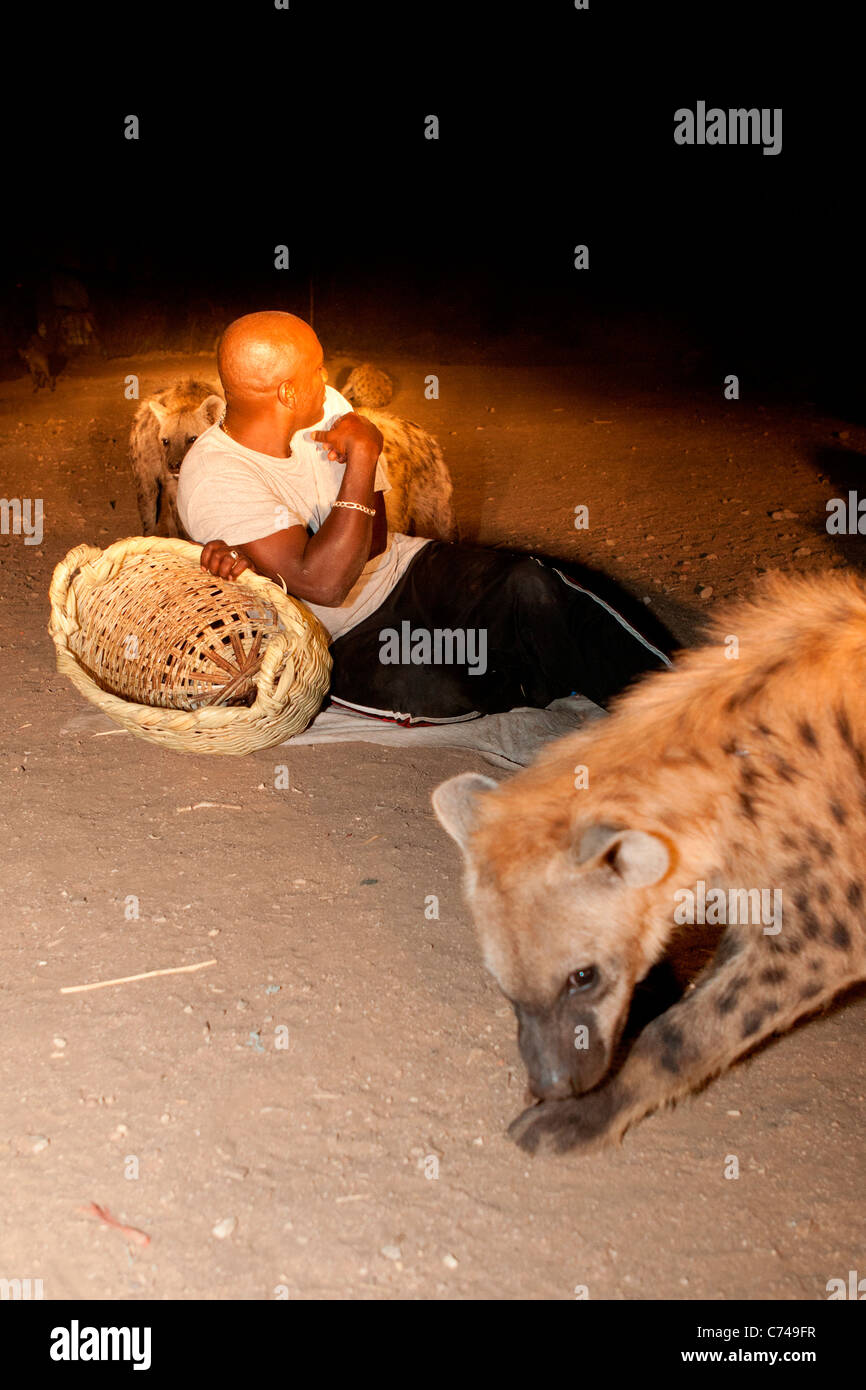 The Hyena Man feeding hyenas near Sanga Gate just outside the city ...