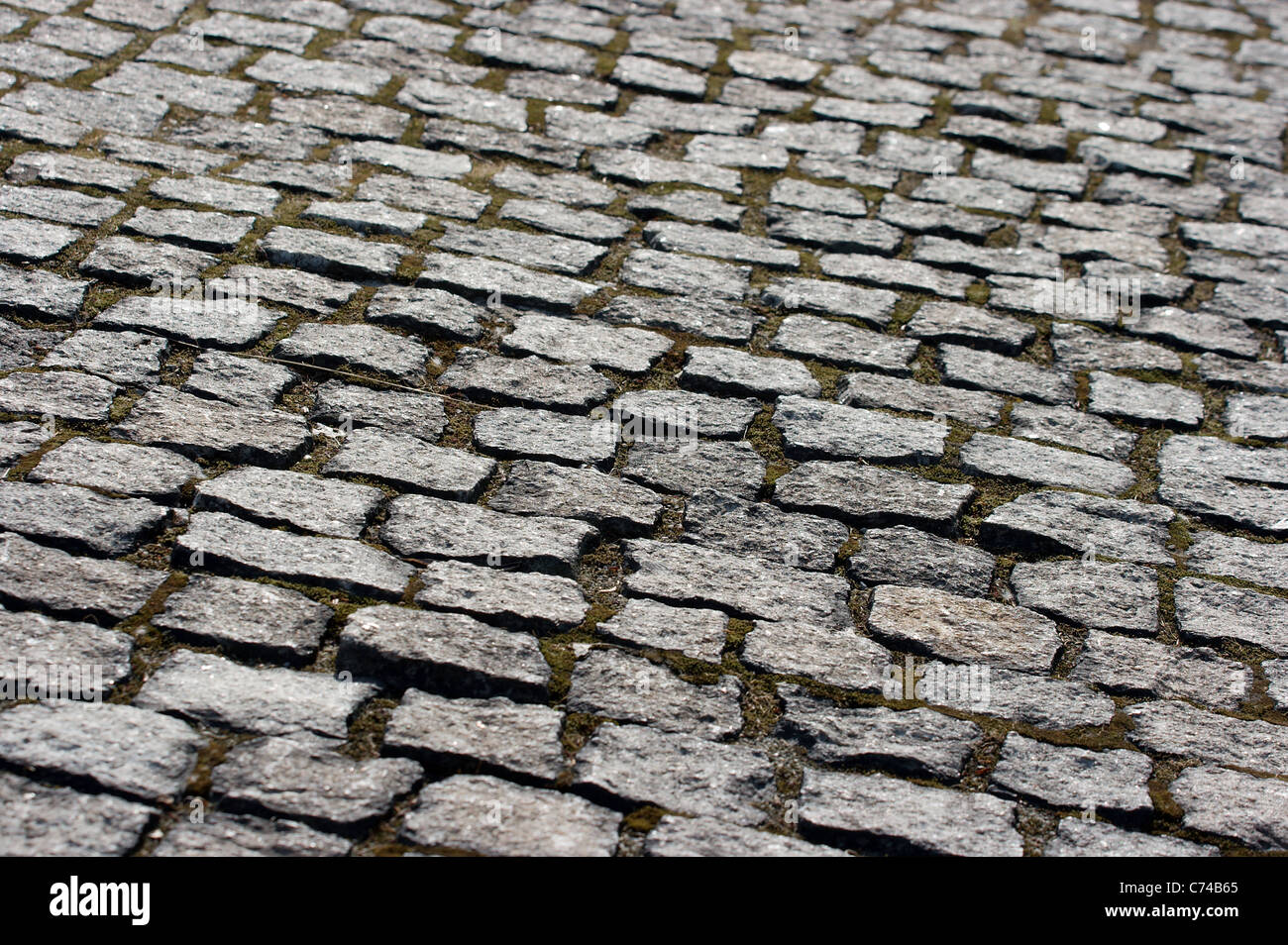 Old stone pavement closeup, small stones Stock Photo - Alamy