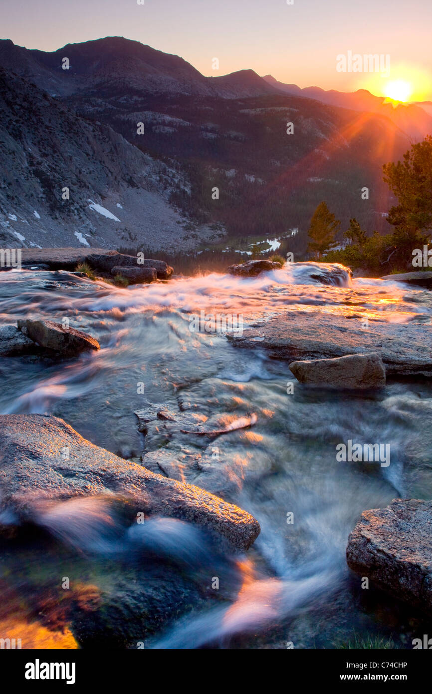 Sunset reflection on Evolution Creek in the Sierra Nevada Mountains in ...