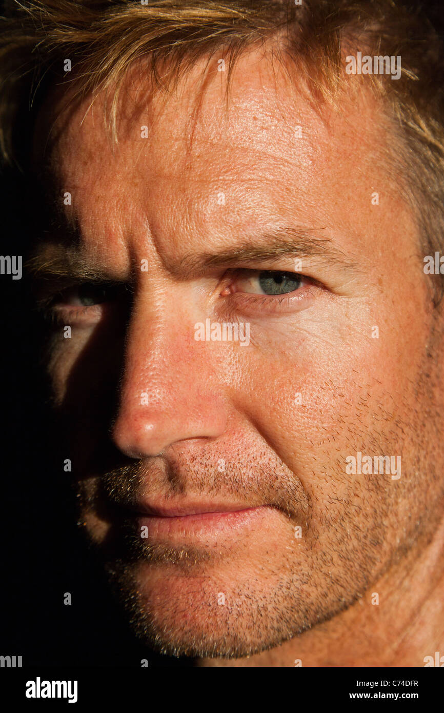 Close-up portrait of 40 years old man looking directly out of picture ...