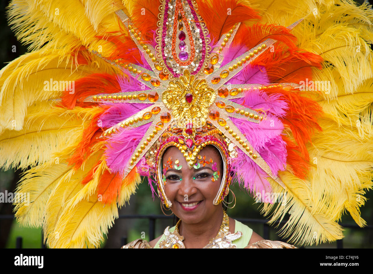 A parade participant in festive attire at the West Indian-American Day ...