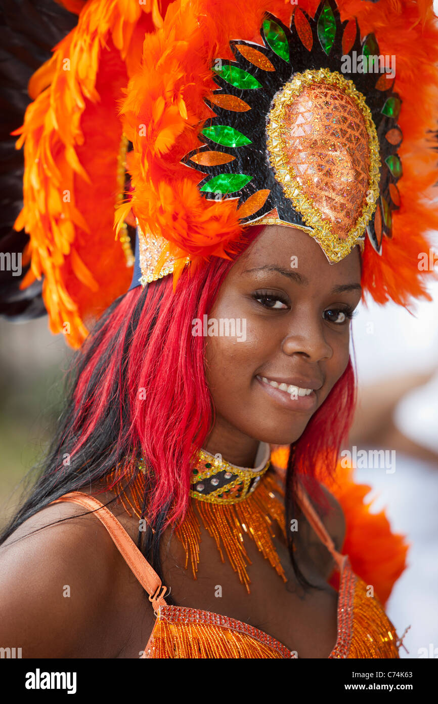 A parade participant in festive attire at the West Indian-American Day ...