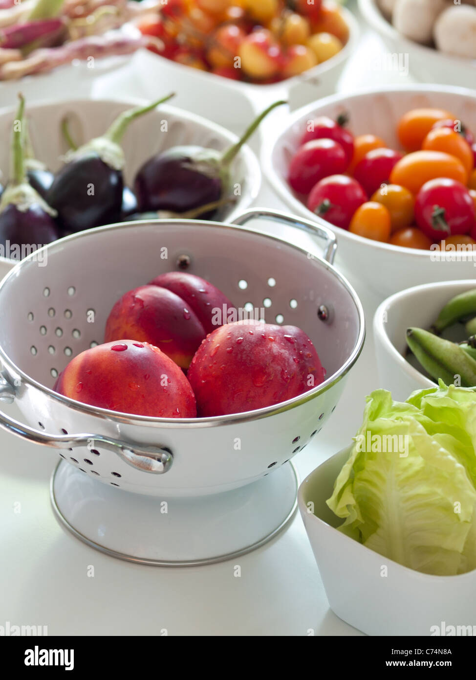 Table of assorted fresh produce consisting of fruits and vegetables ...