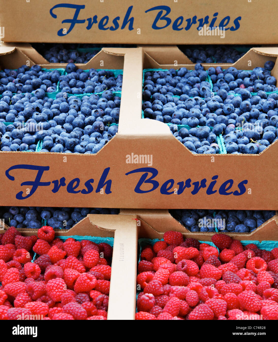 Ripe juicy raspberry in boxes hi-res stock photography and images - Alamy