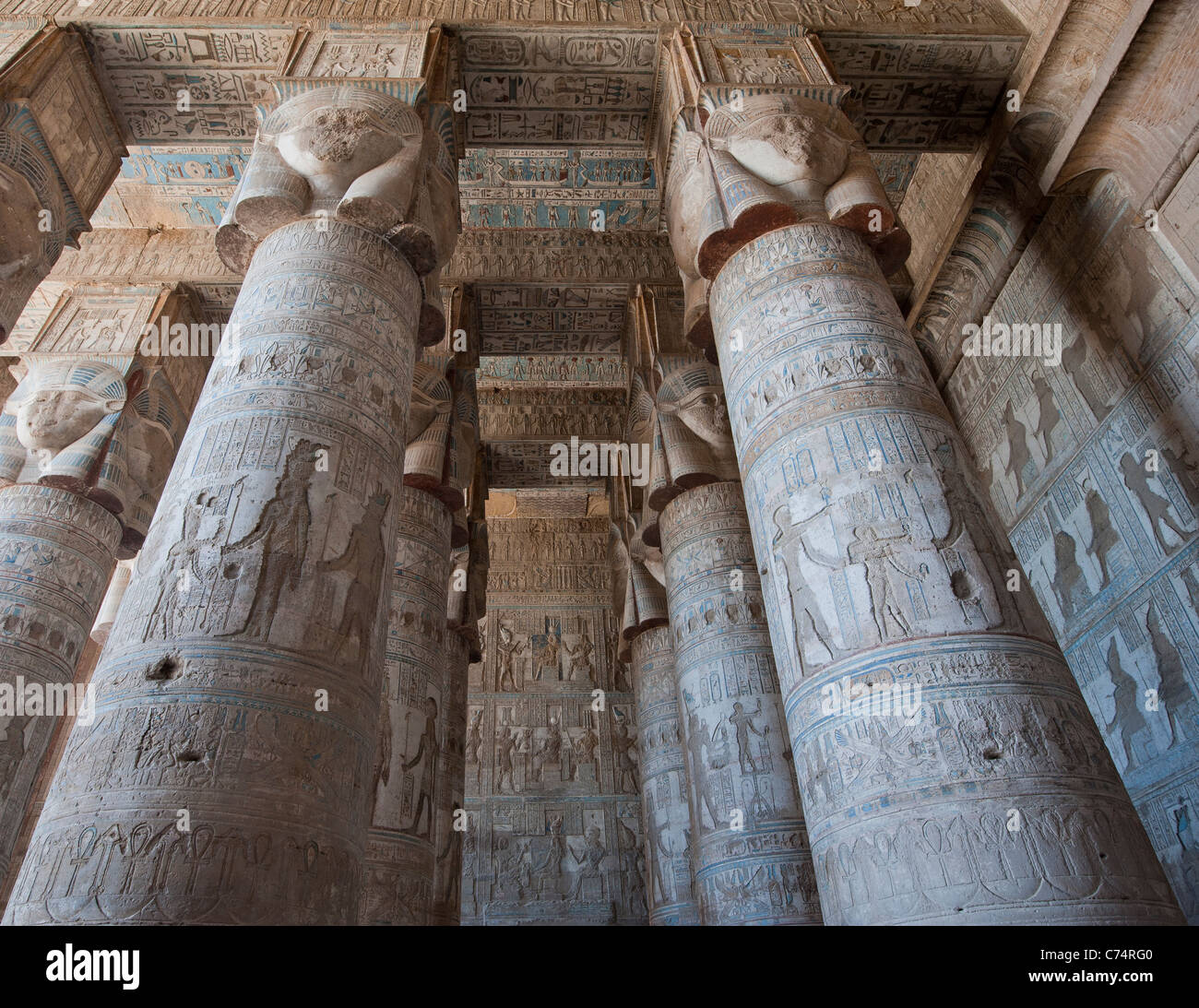 Columns inside an ancient egyptian temple covered in hieroglyphic ...