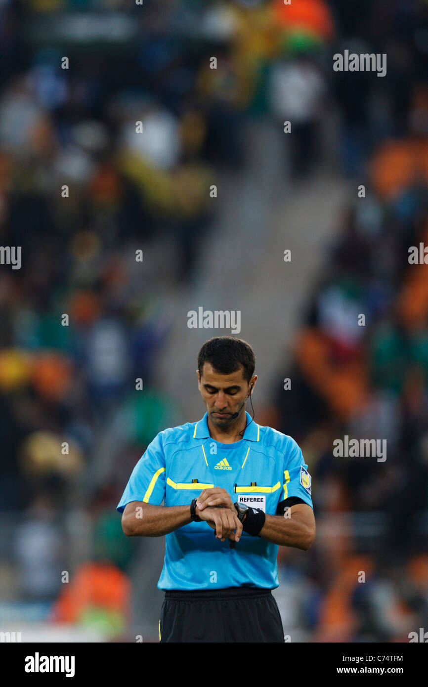 Checking time referee hi-res stock photography and images - Alamy