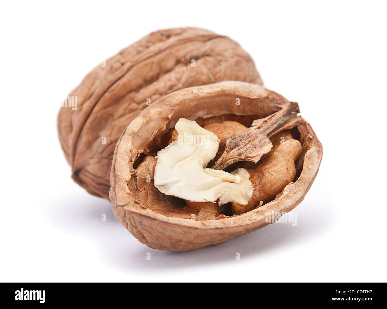Walnut brown nut closeup isolated on white Stock Photo - Alamy
