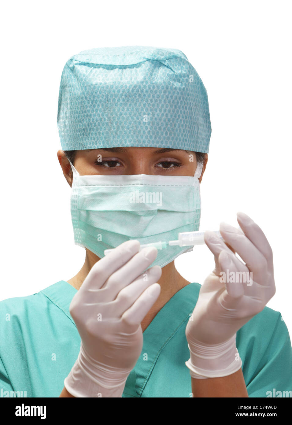 Female nurse holding a syringe and its needle.Selective focus on the ...