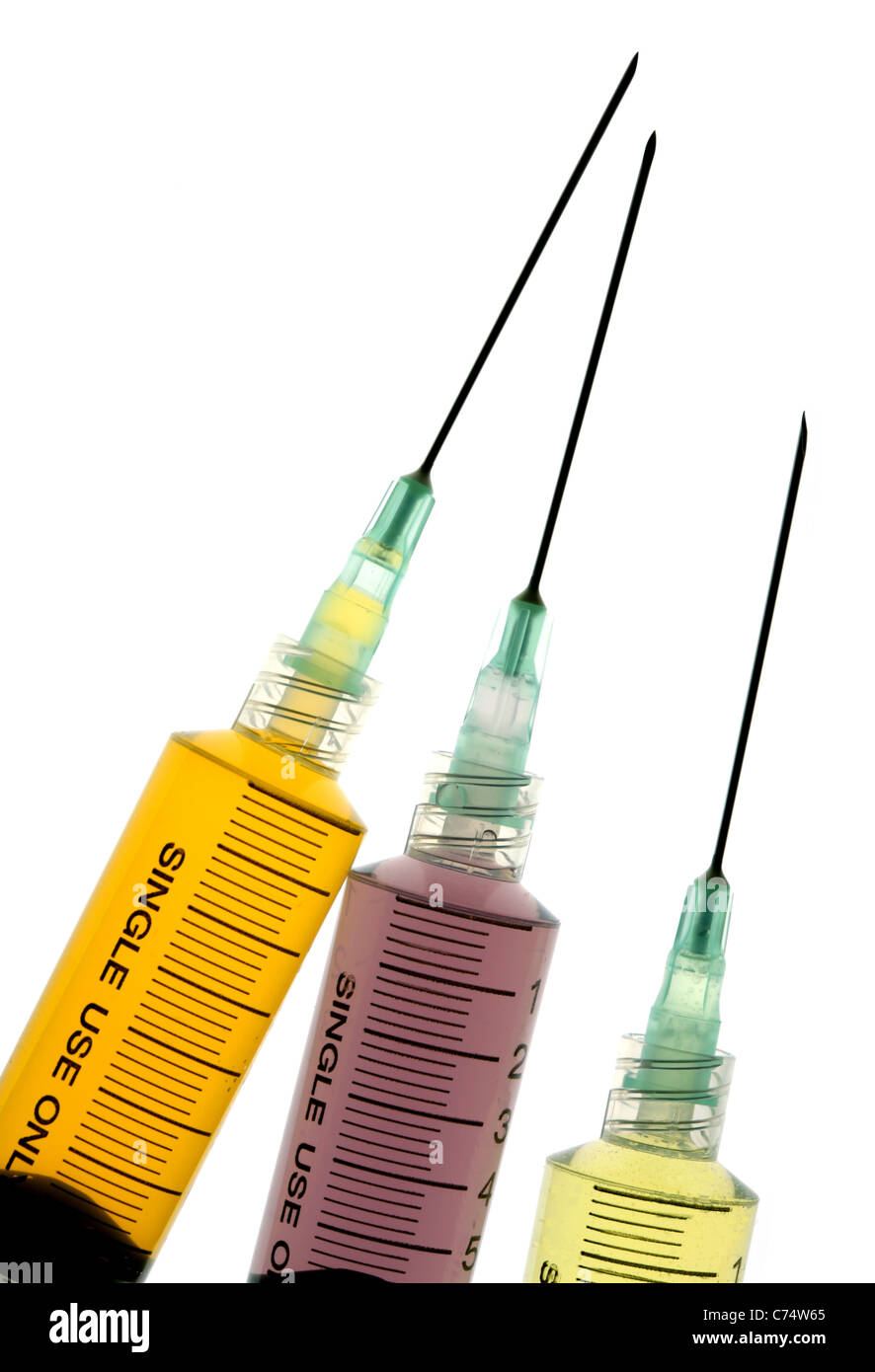 Three disposable hypodermic syringes hi-res stock photography and ...