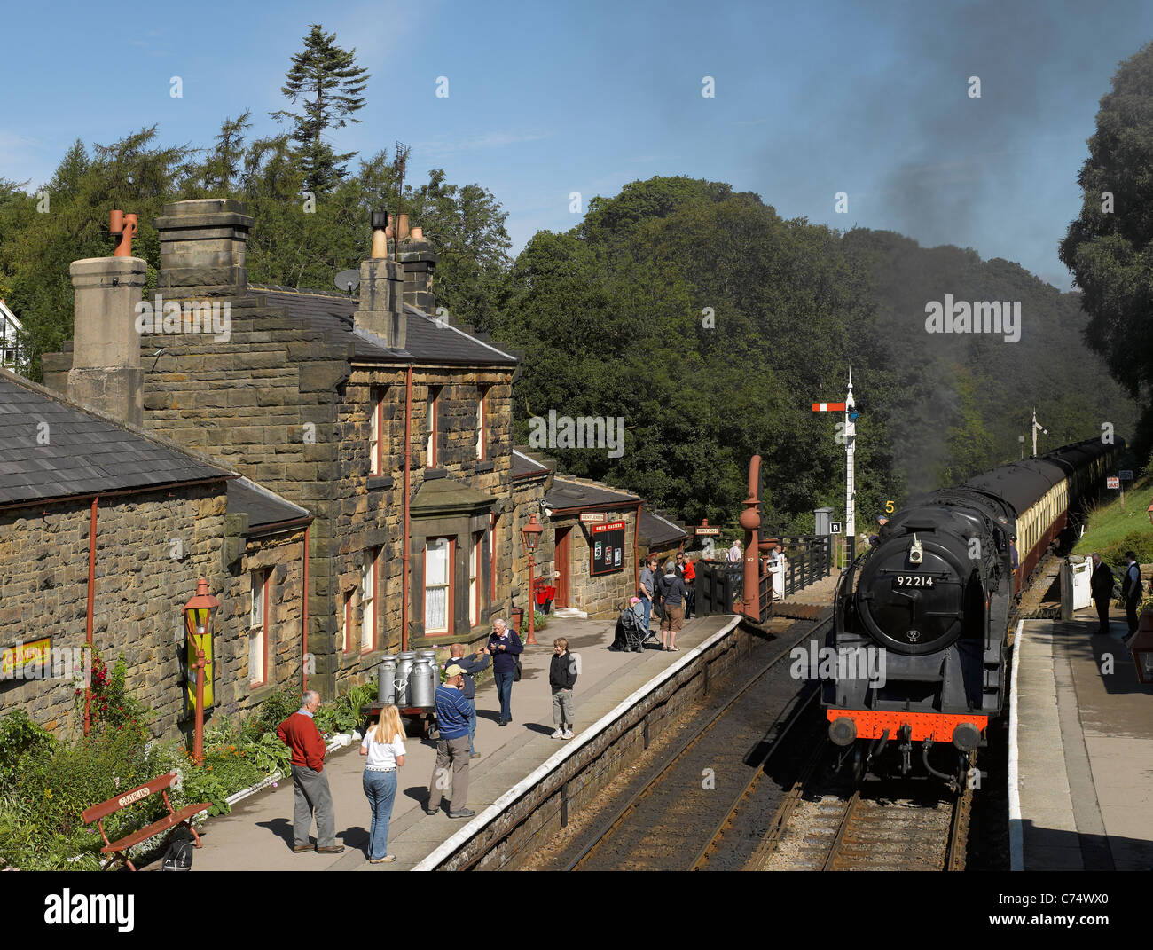Steam Train engine 9f 92214 Cock O the North enters Goathland station ...