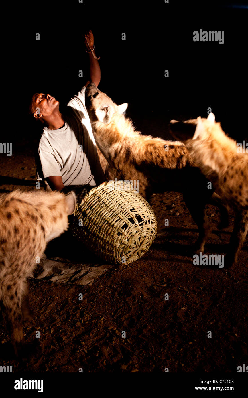 The Hyena Man feeding hyenas near Sanga Gate just outside the city ...