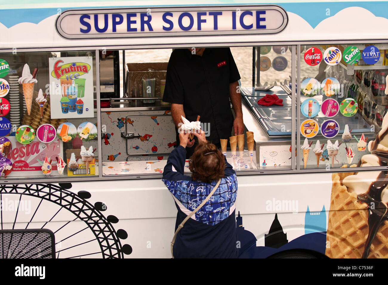 A lady purchasing ice cream cones from a mobile ice cream van Stock ...