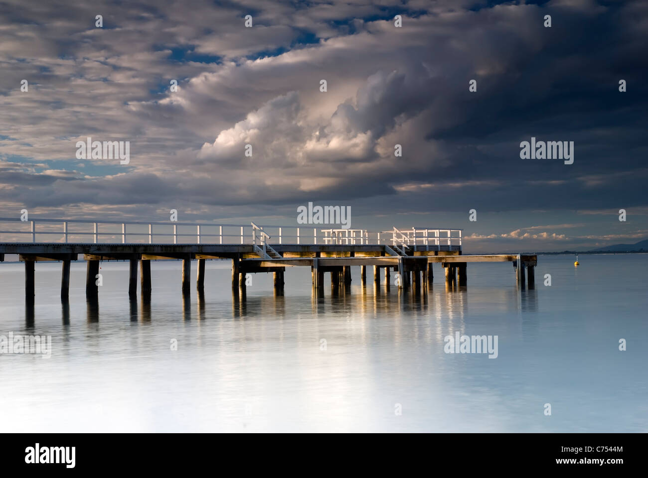 Sunbeams on the pier at Davey's Bay, during the last light, Melbourne ...