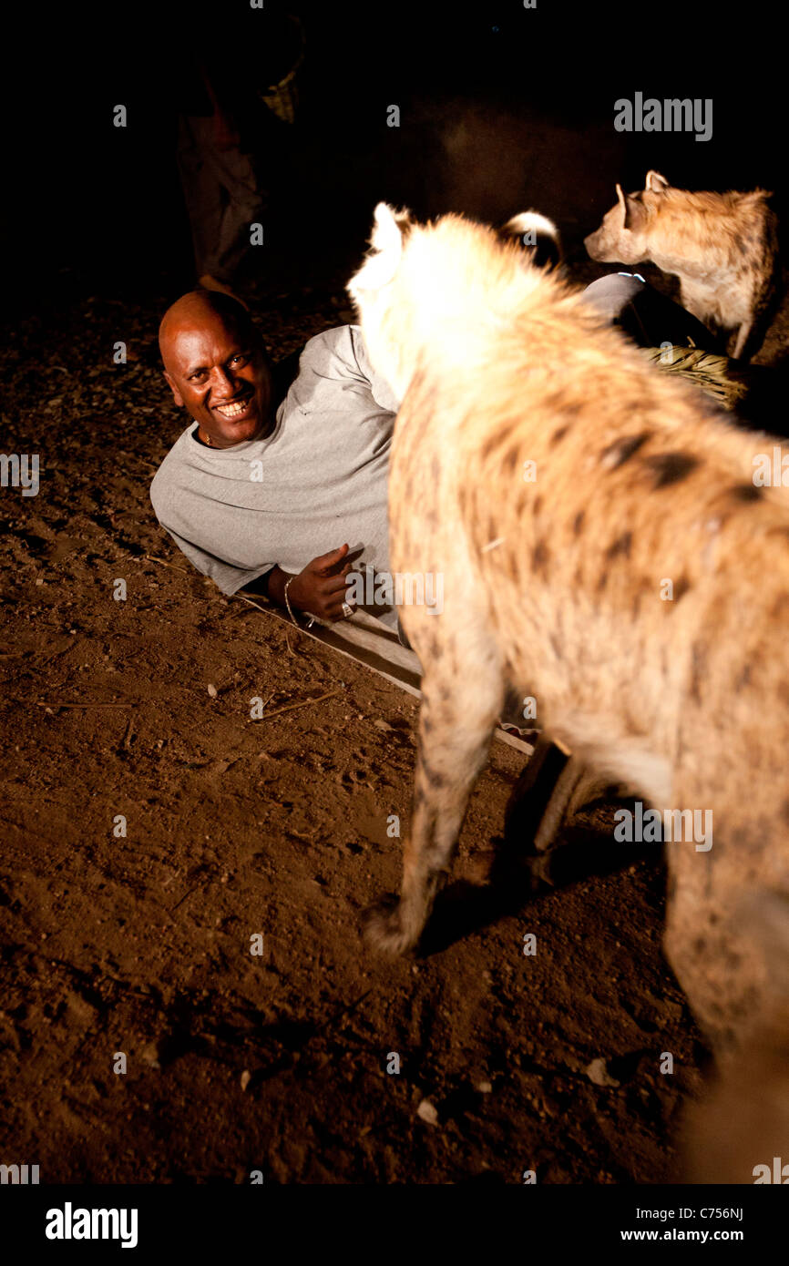 The Hyena Man feeding hyenas near Sanga Gate just outside the city ...