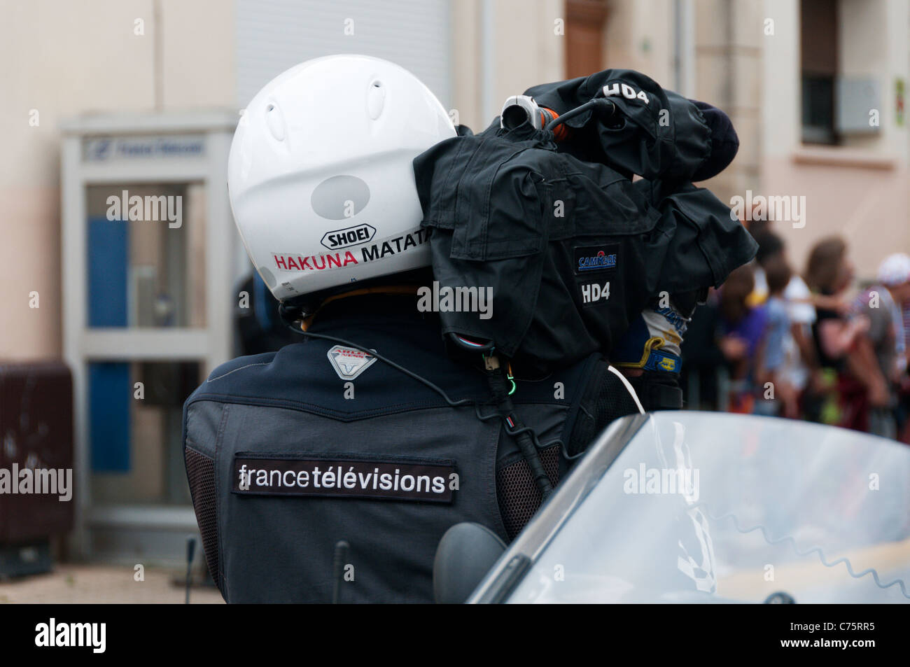 An outside broadcast cameraman for France Televisions filming the Tour ...