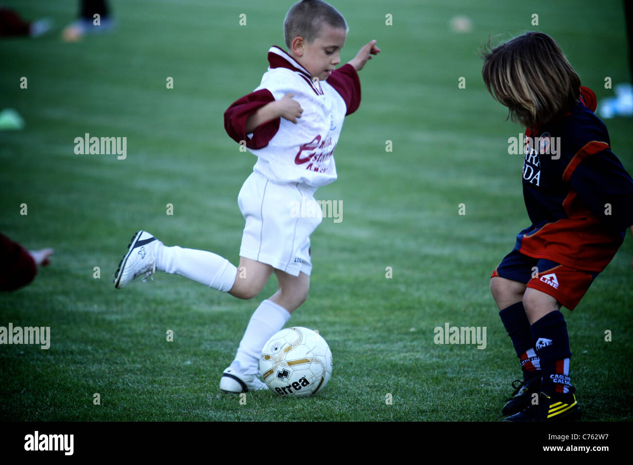 young kid soccer players confrontation to goal Stock Photo - Alamy