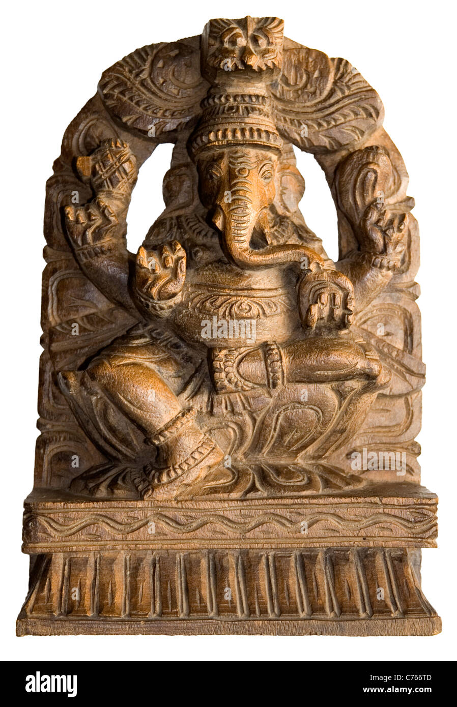A wooden carving of the Hindu God Ganesh, isolated on white background ...