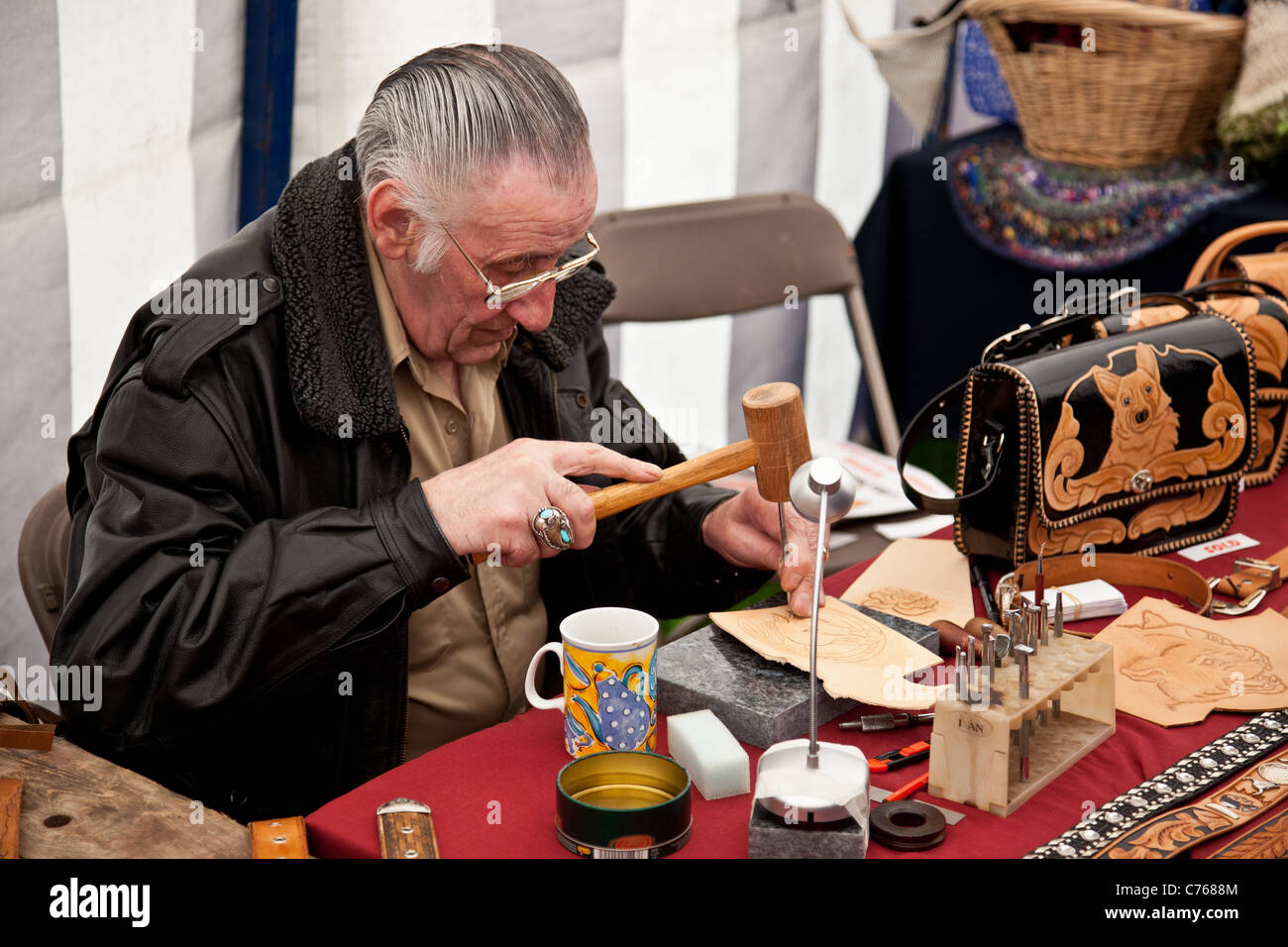 Craftsman working on leather stall at the Westmorland County Show, 8th ...
