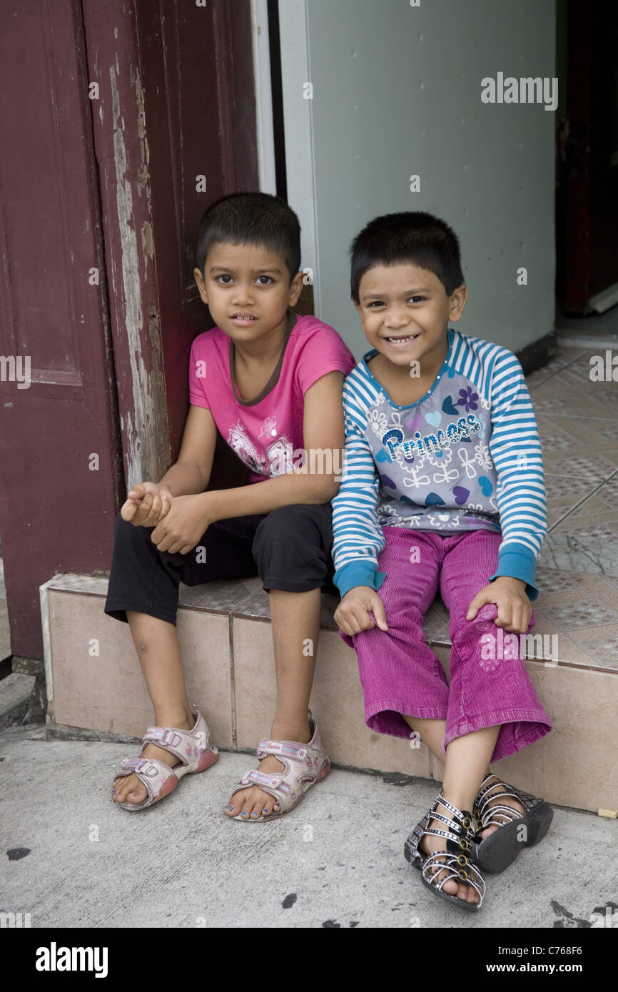Bangladeshi American sisters on the stoop of their apartment building ...