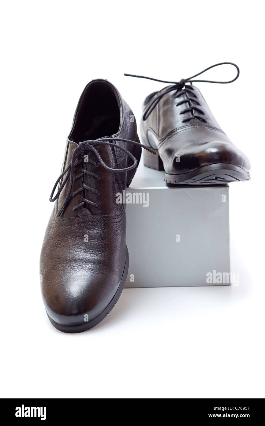 New black shoes with laces and grey box on a white background Stock ...