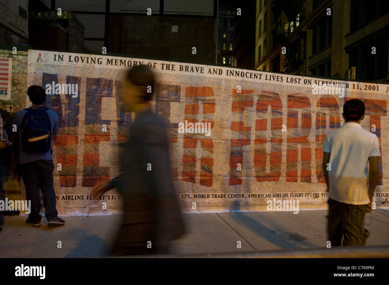 People walk by a memorial on the tenth anniversary of the September 11 ...