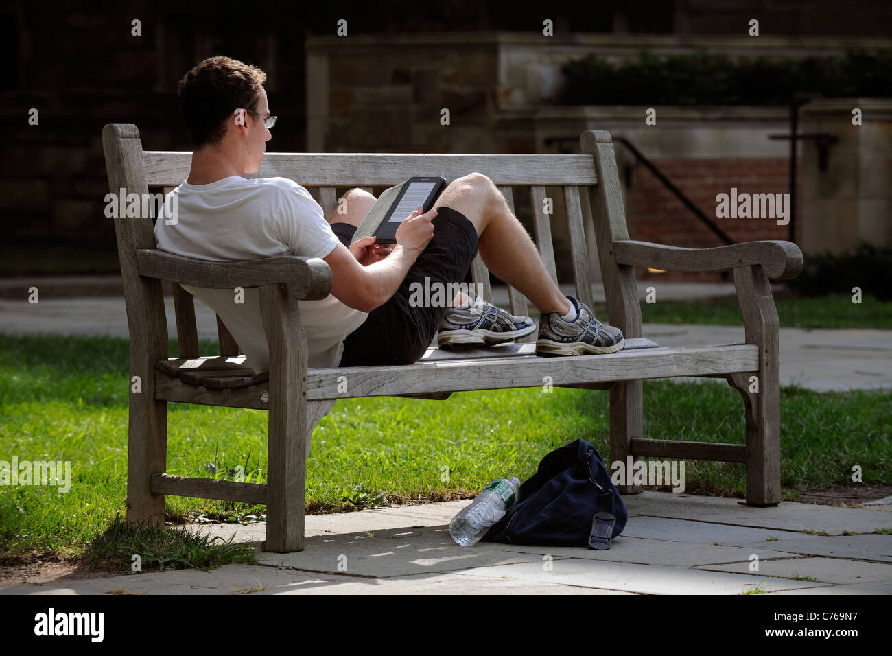 Yale University Summer School student reading a Kindle sitting in a ...