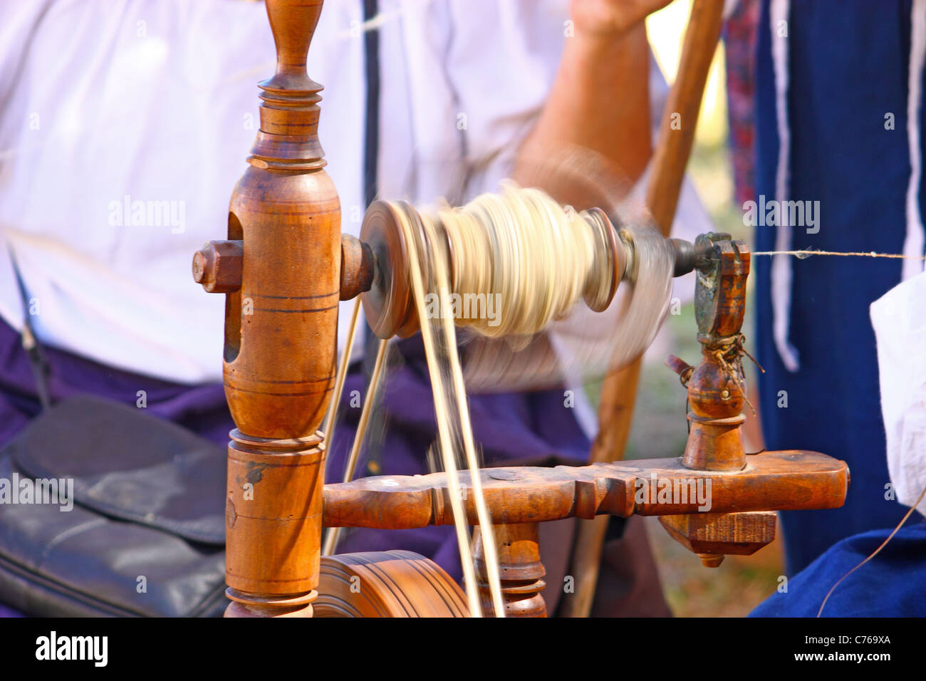 The hands of the elderly woman spinning a plant fiber string Stock ...