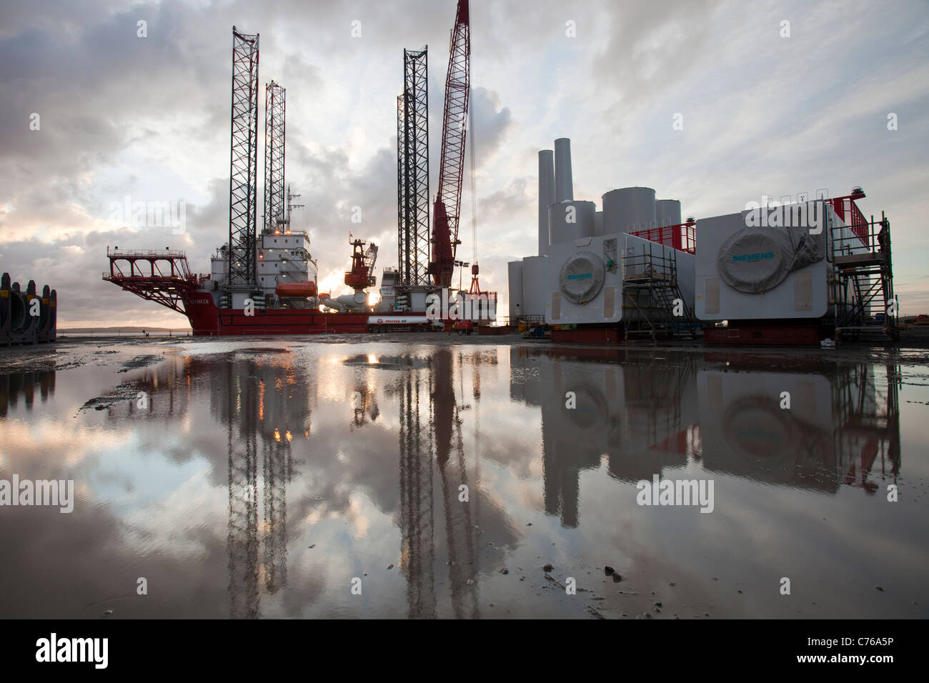 A jack up barge being loaded with wind turbine parts for the walney ...
