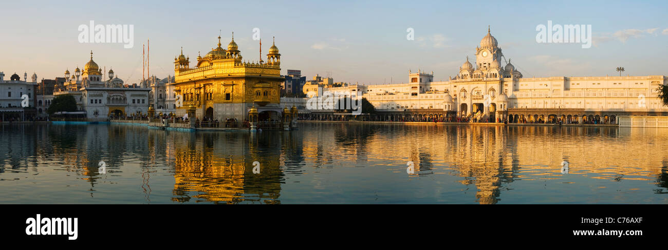 Panoramic view of the Sikh Golden Temple in the last rays of the sun in ...