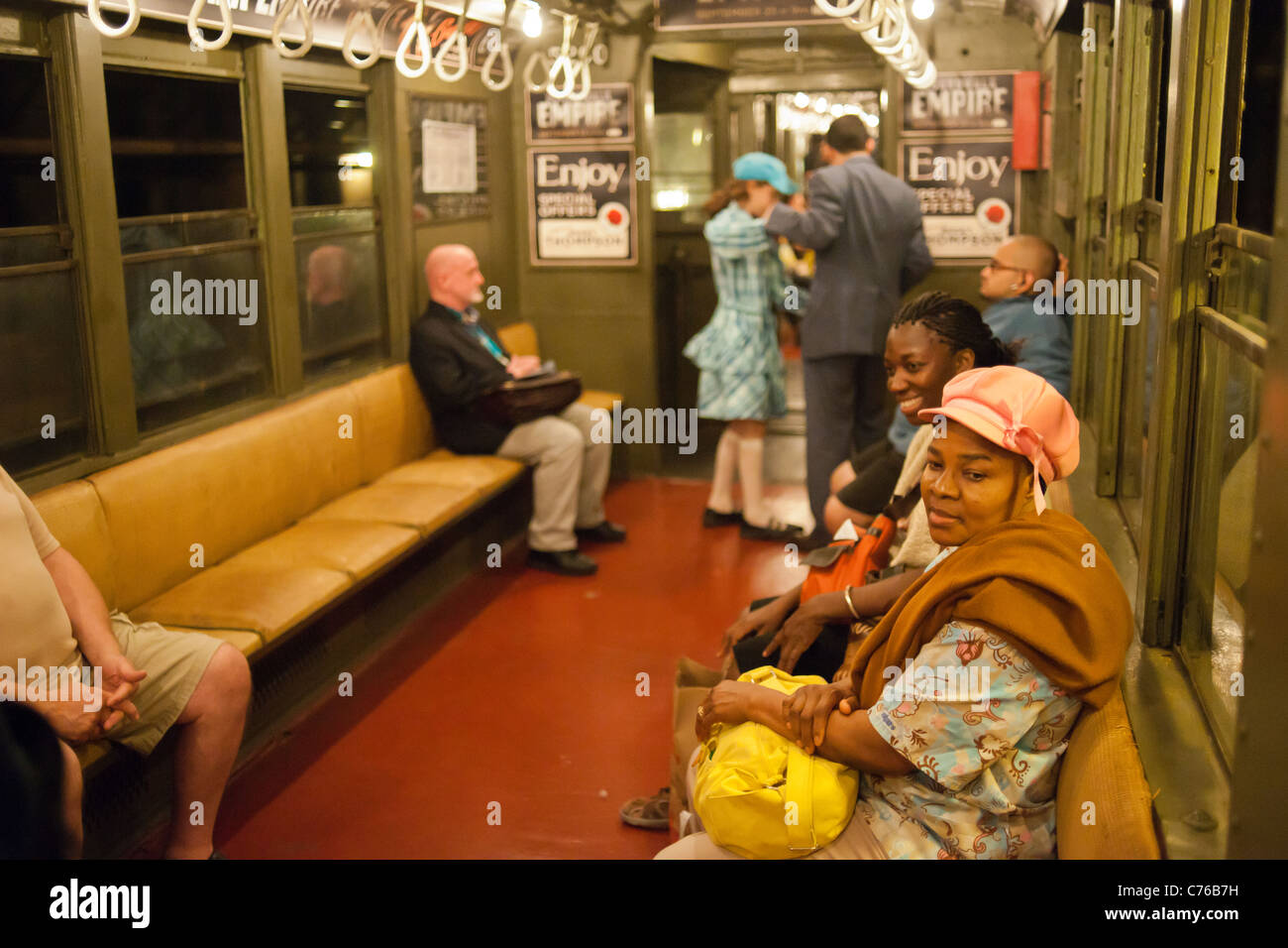 New Yorkers, tourists and subway buffs travel on the West Side IRT line ...