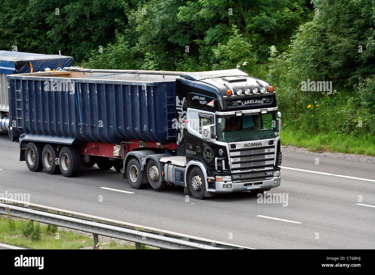 Lorries or trucks on a motorway or road Stock Photo - Alamy