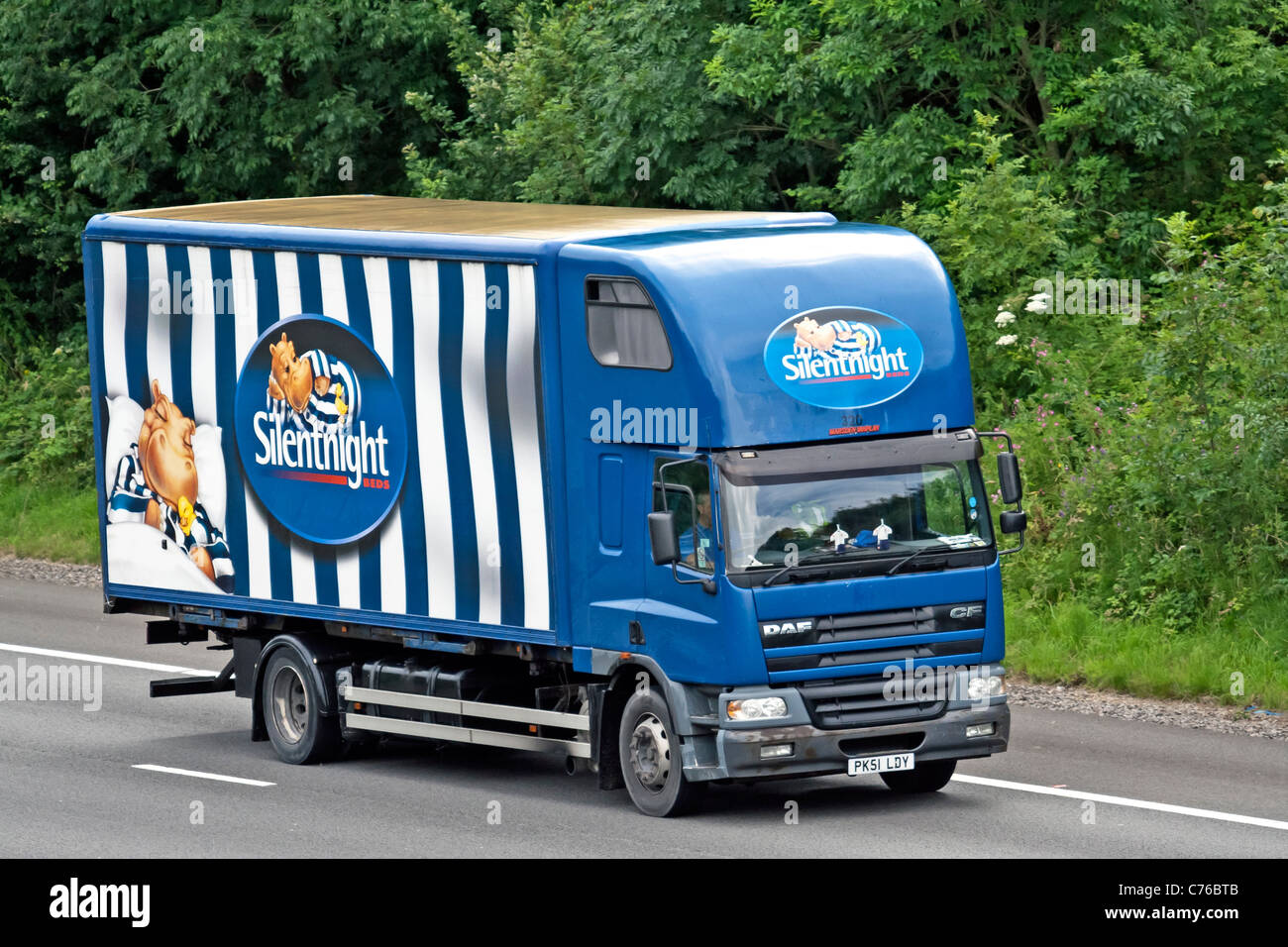 Lorries or trucks on a motorway or road Stock Photo - Alamy