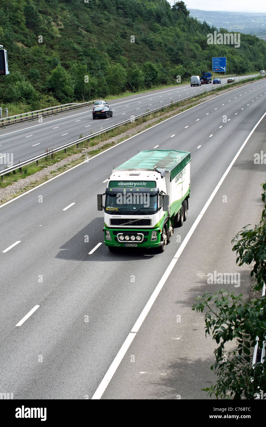 Lorries or trucks on a motorway or road Stock Photo - Alamy