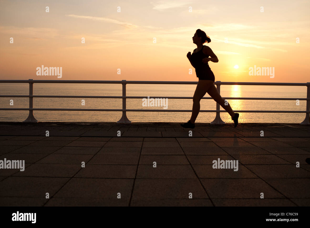 Woman jogging silhouette hi-res stock photography and images - Alamy