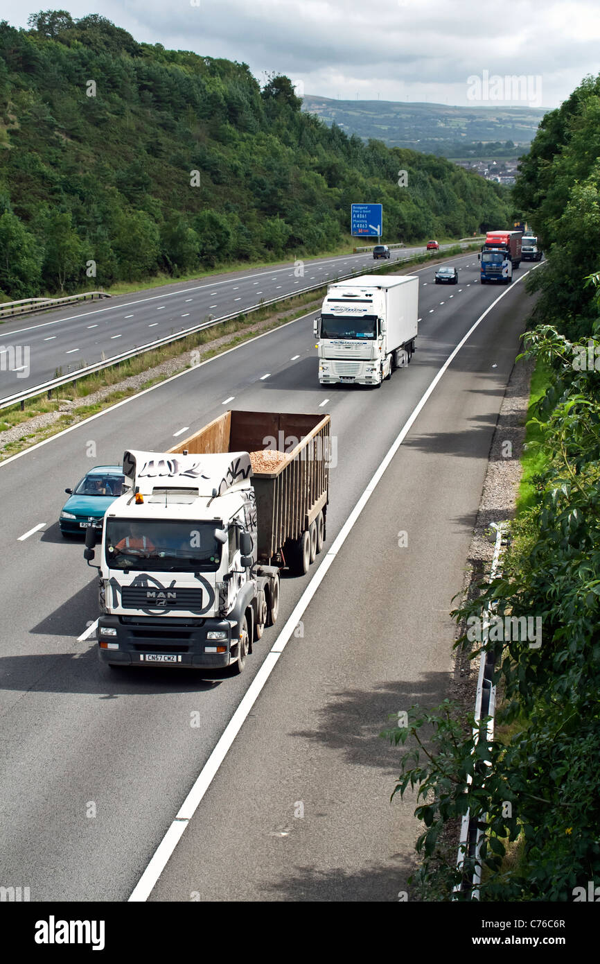Lorries or trucks on a motorway or road Stock Photo - Alamy