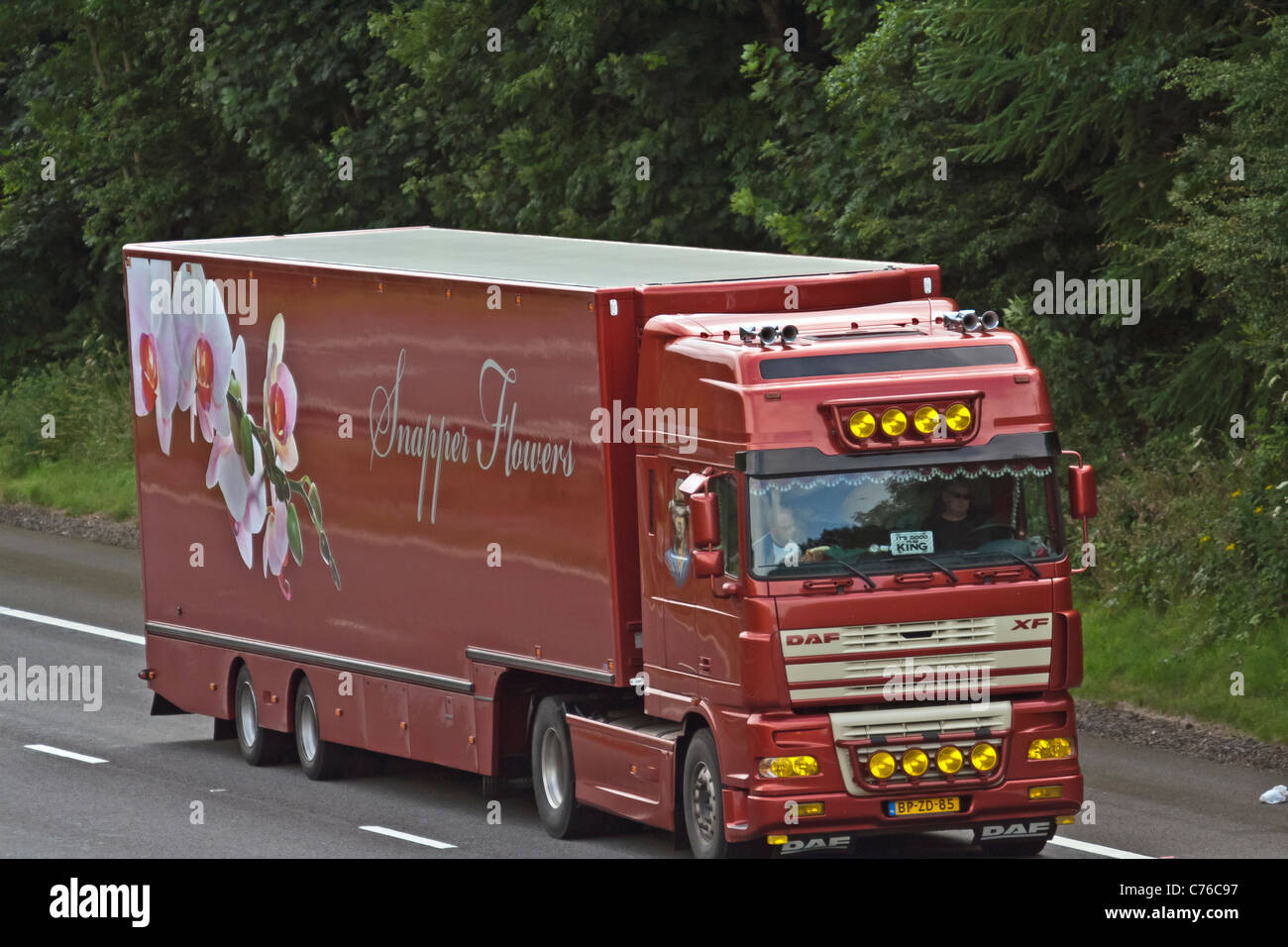 Lorries or trucks on a motorway or road Stock Photo - Alamy
