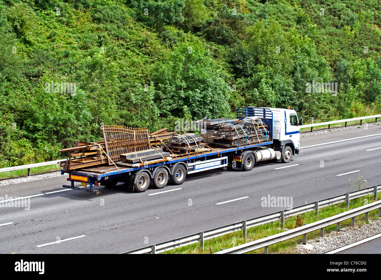 Lorries or trucks on a motorway or road Stock Photo - Alamy
