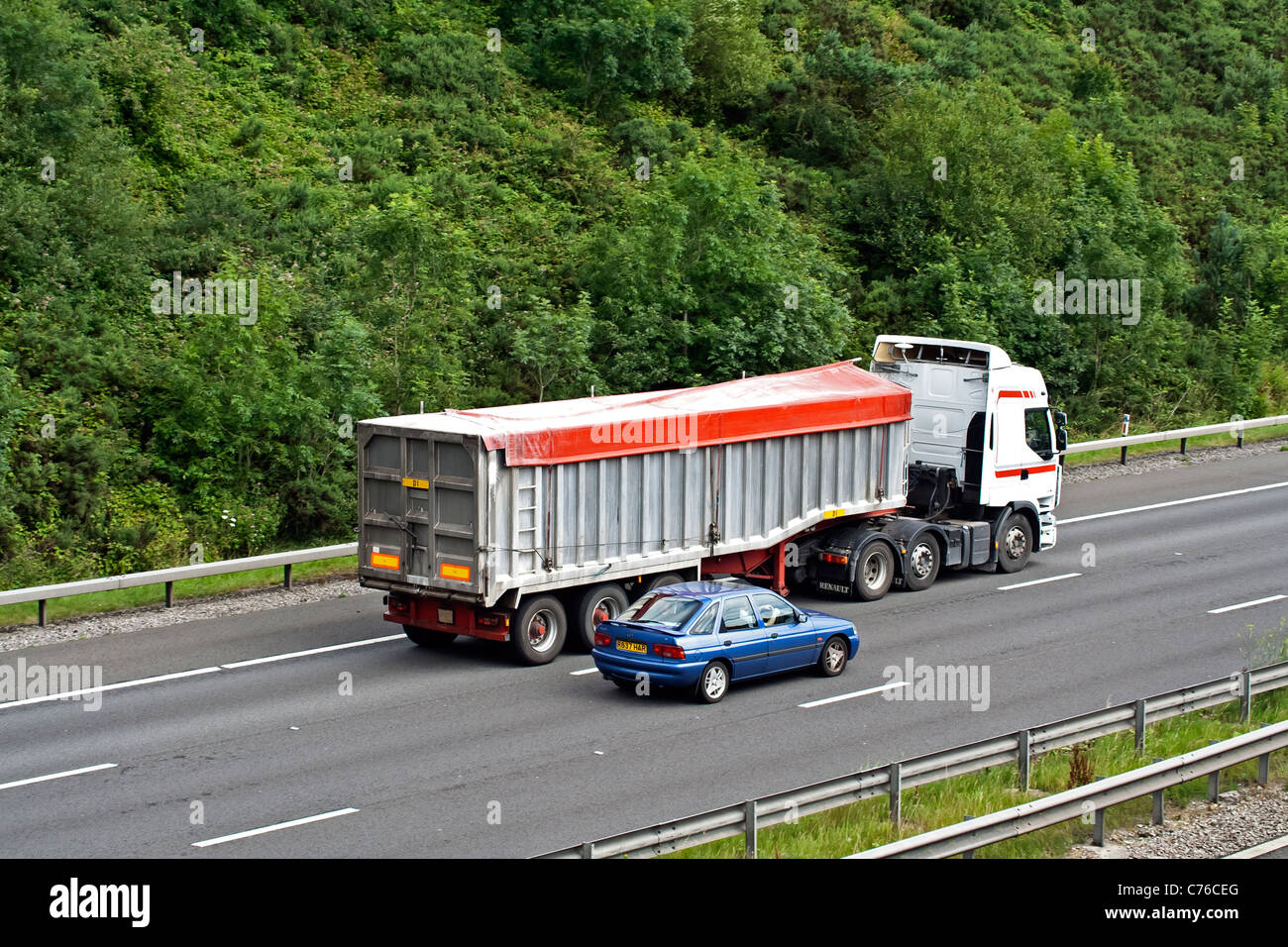 Lorries or trucks on a motorway or road Stock Photo - Alamy