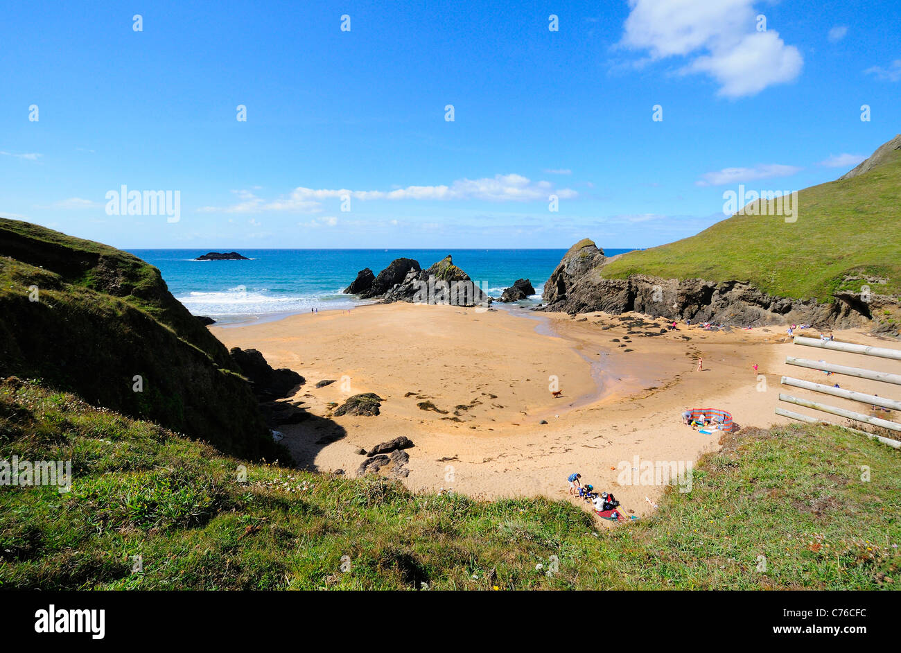 Families picnicking on the secluded sandy cove beach at Soar Cove near ...
