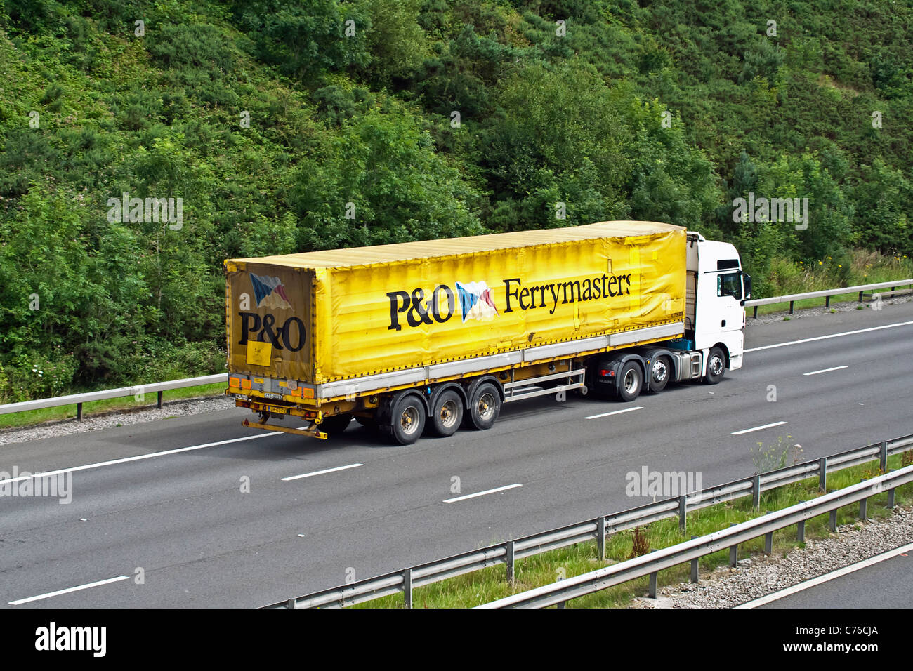 Lorries travel along the M4 motorway in South Wales, with heavy goods ...
