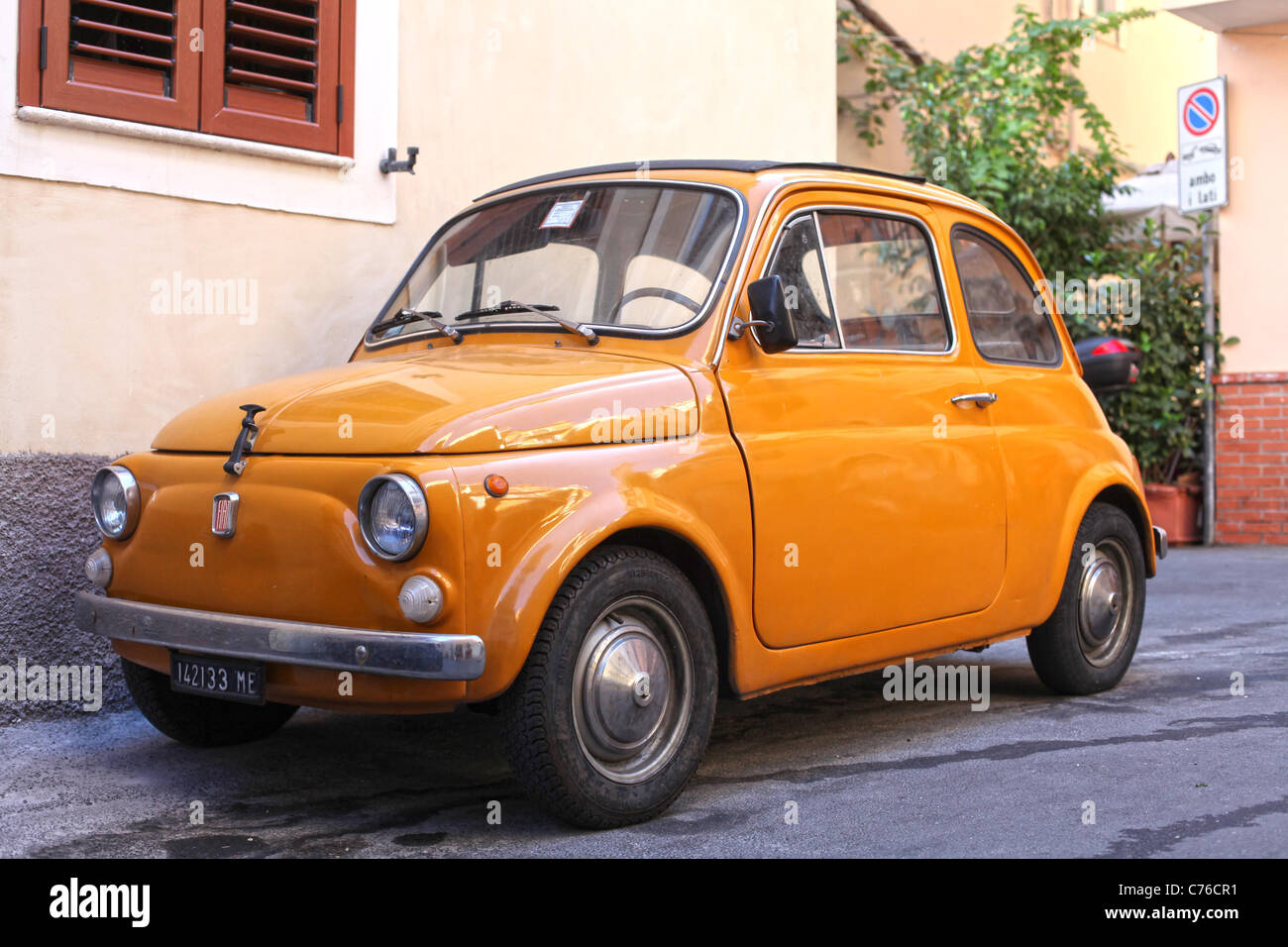 A yellow Fiat 500 in a back street in Taormina, Sicily. Picture by ...