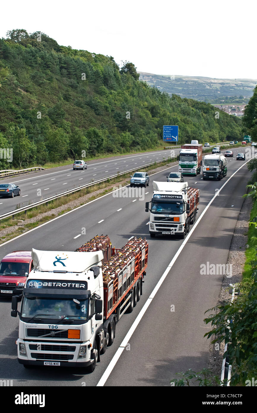 Lorries or trucks on a motorway or road Stock Photo - Alamy