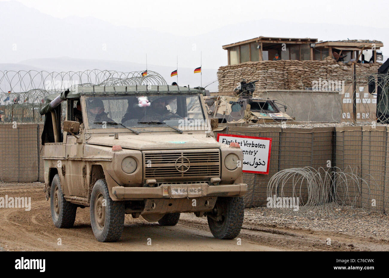 ISAF soldiers passing the main gate of Camp Marmal Mazar-e Sharif ...