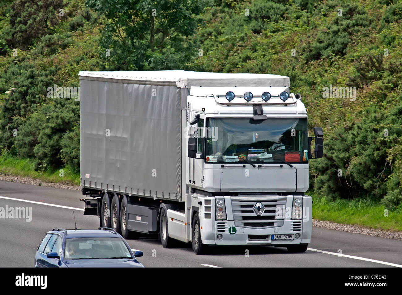 Lorries and trucks travel along the M4 motorway in South Wales, a major ...