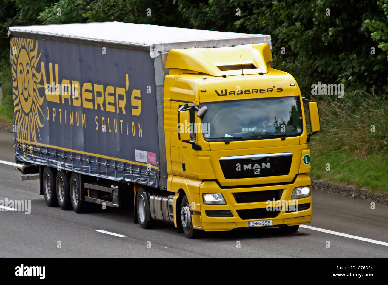 Lorries or trucks on a motorway or road Stock Photo - Alamy