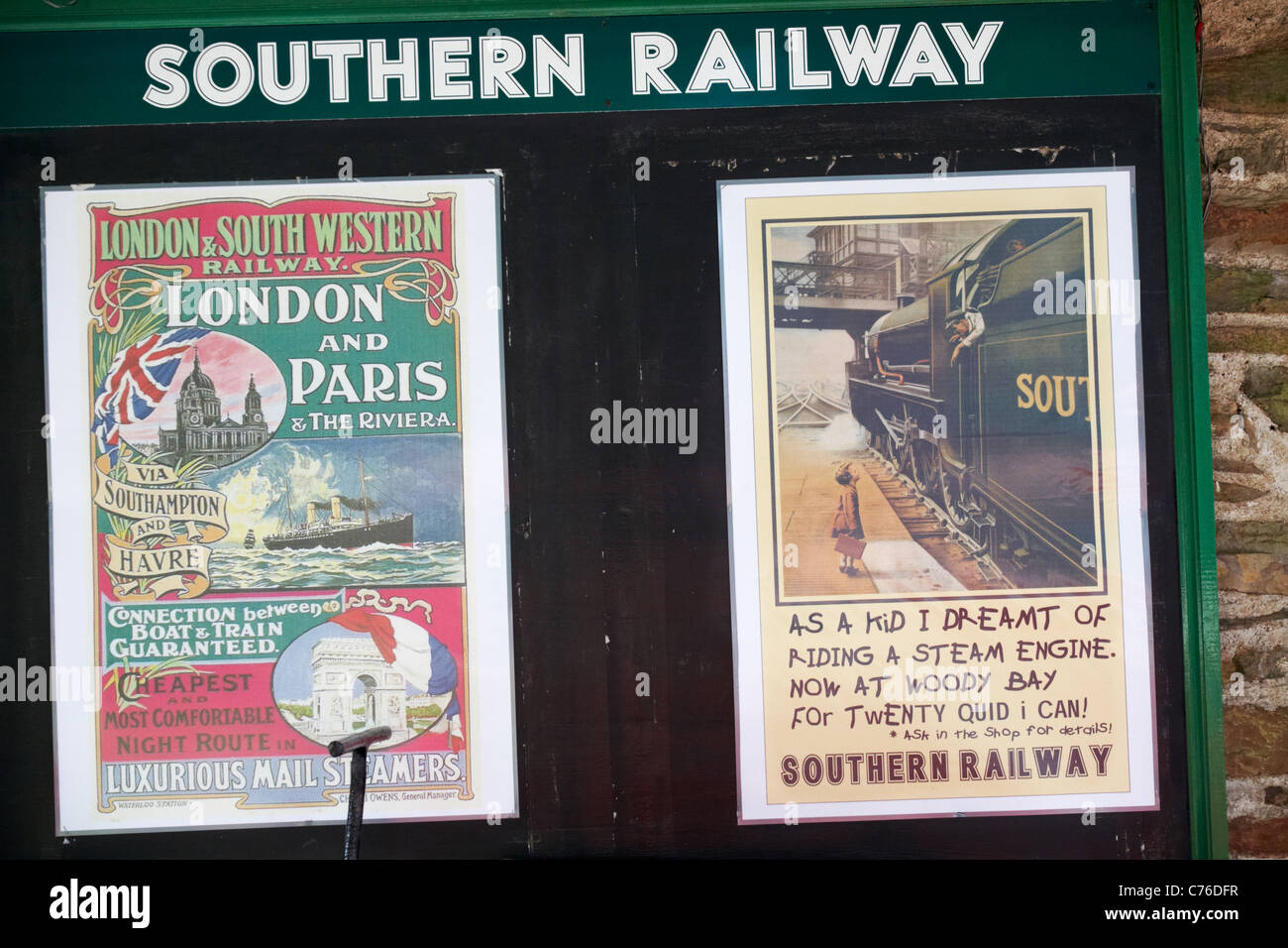 Posters on display at Woody Bay Station in August Stock Photo - Alamy